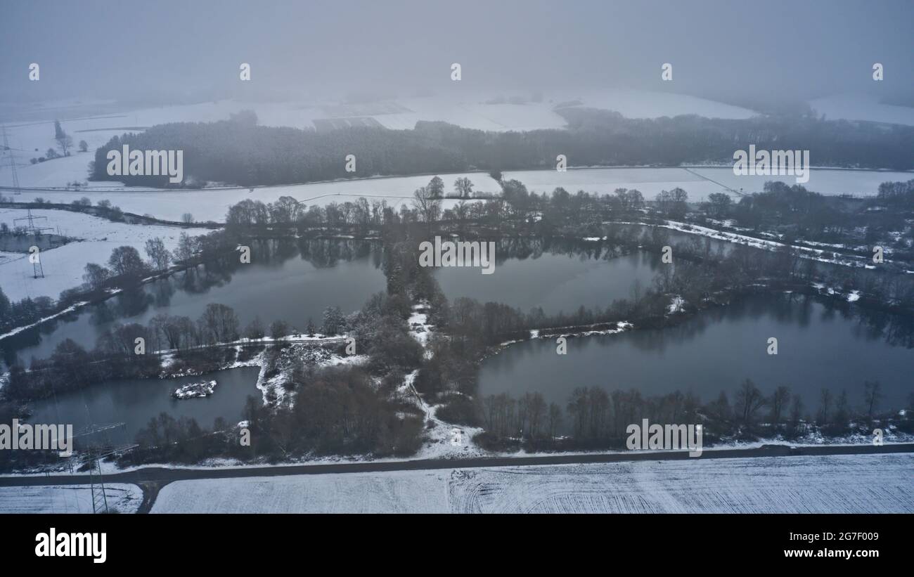 Aerial eye view of frozen ponds in the woods Stock Photo - Alamy