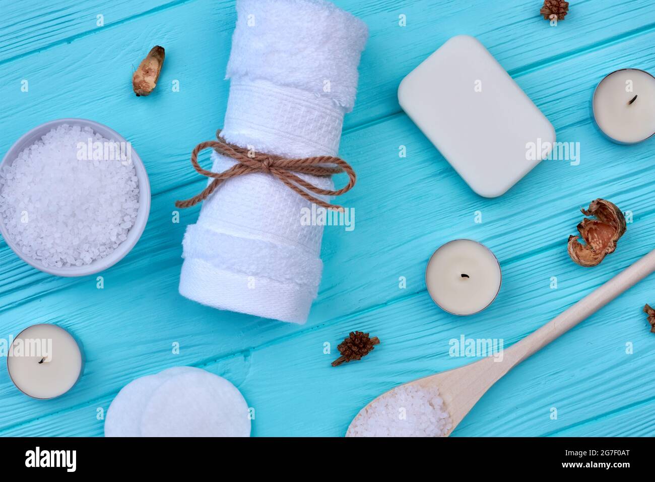 Set of white spa bathroom stuff on blue wooden desk Stock Photo - Alamy