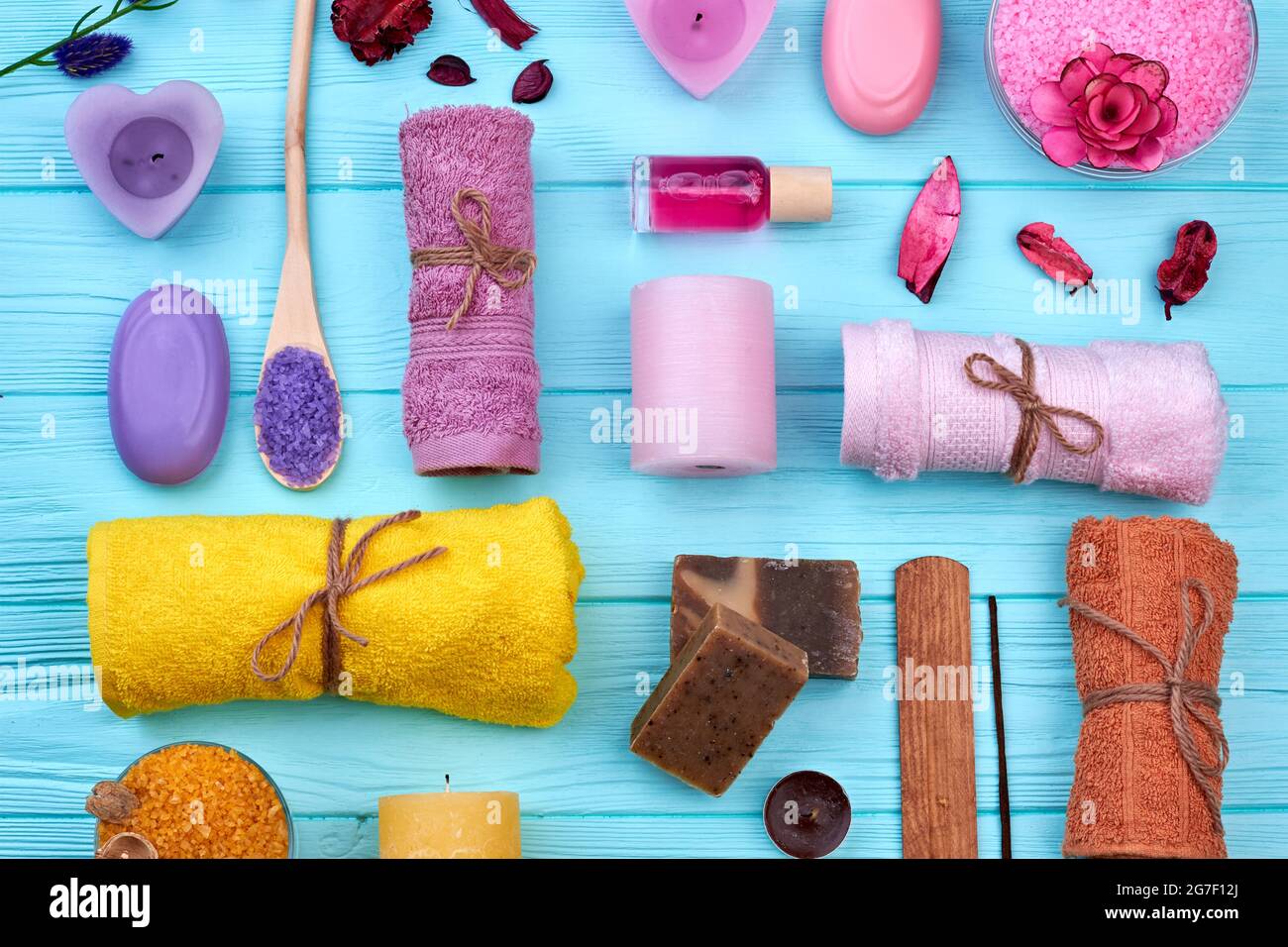 Set of aroma spa stuff on blue wooden table Stock Photo - Alamy