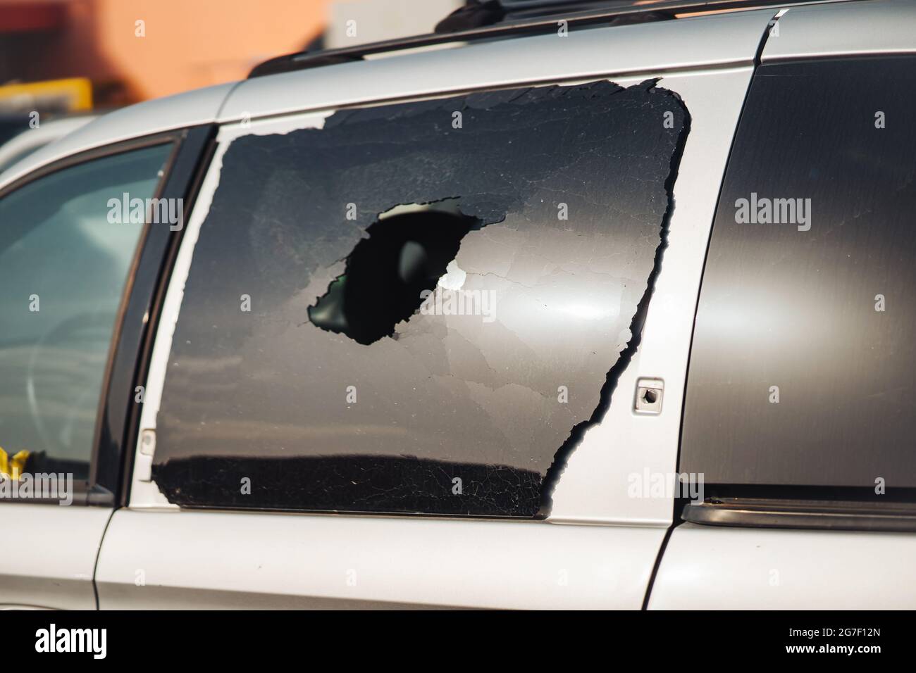 Theft from a parked car, intruders broke the rear window Stock Photo - Alamy