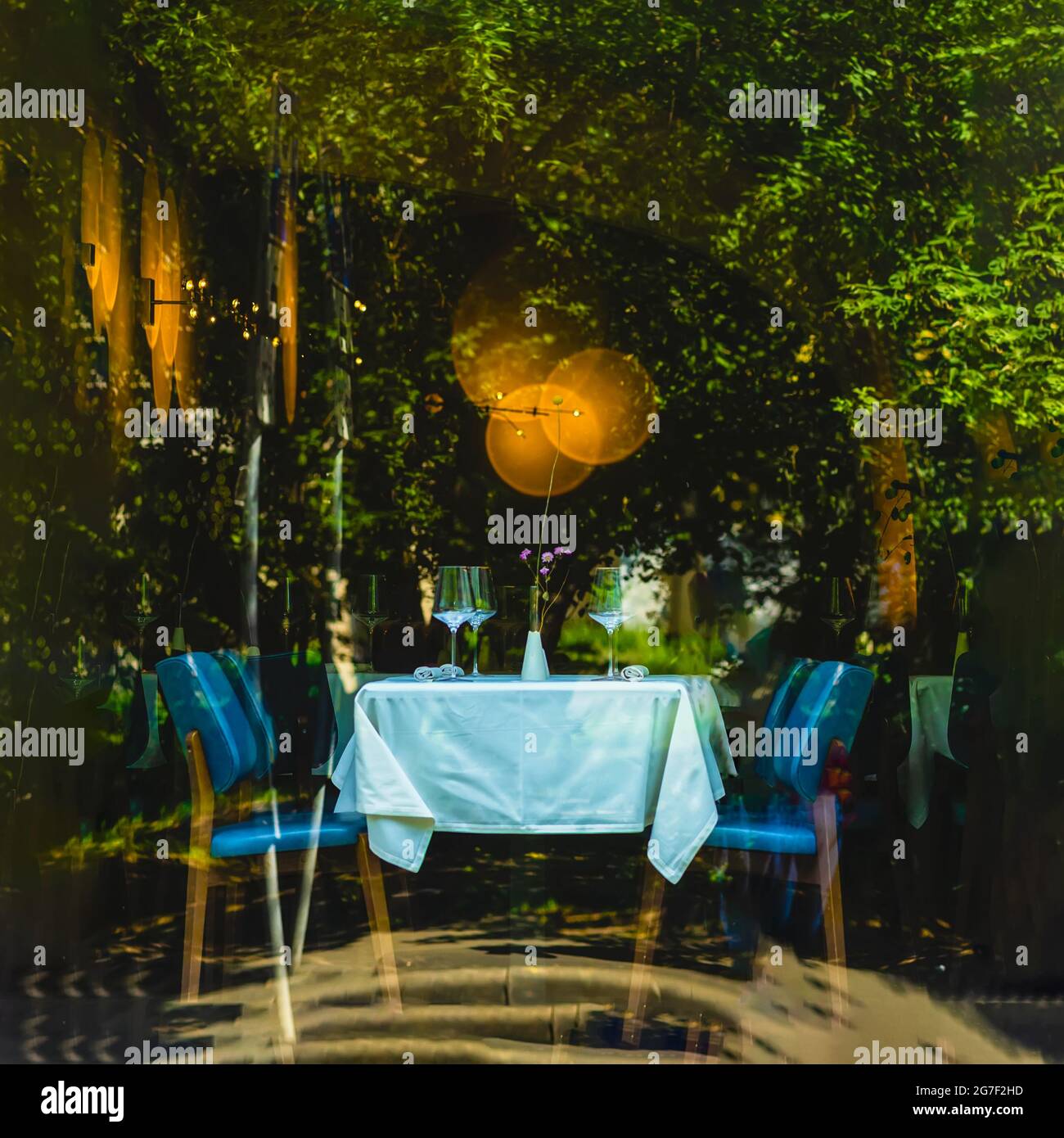 Dinner restaurant table evening light hi-res stock photography and ...
