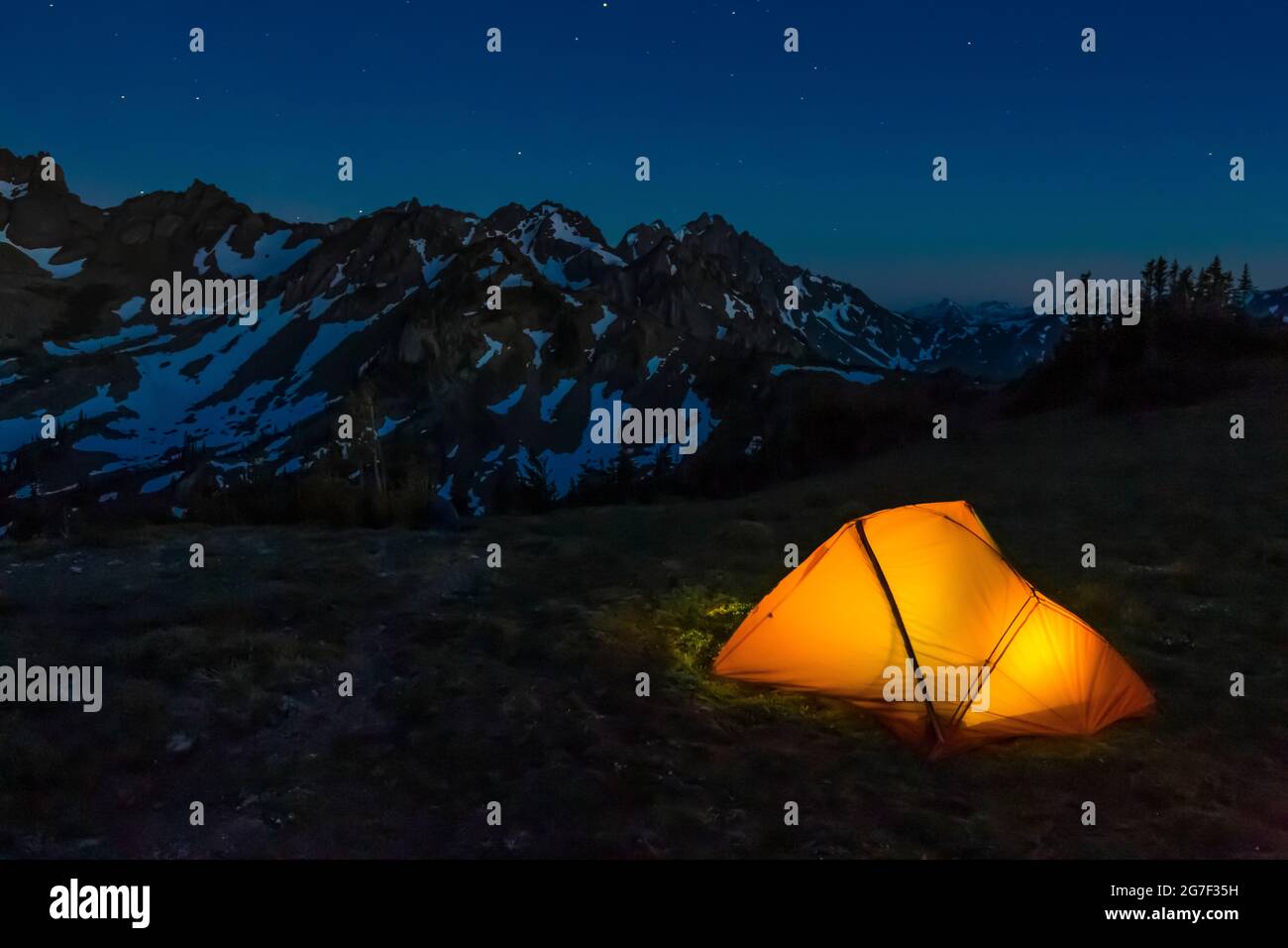 Illuminated backpacking tent at Marmot Pass in the Buckhorn Wilderness ...