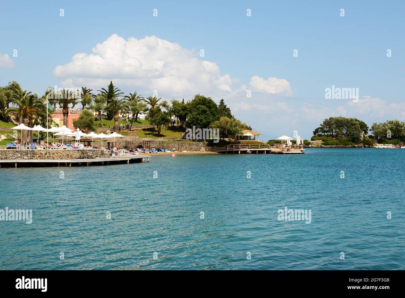 The beach and tourists at luxury hotel, Corfu, Greece Stock Photo - Alamy