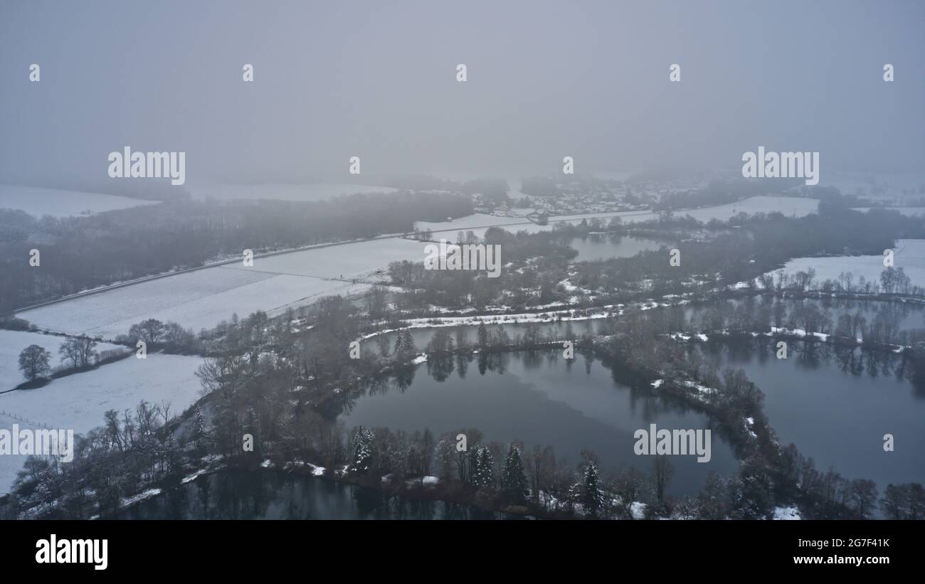 Aerial view of frozen ponds in the woods Stock Photo - Alamy