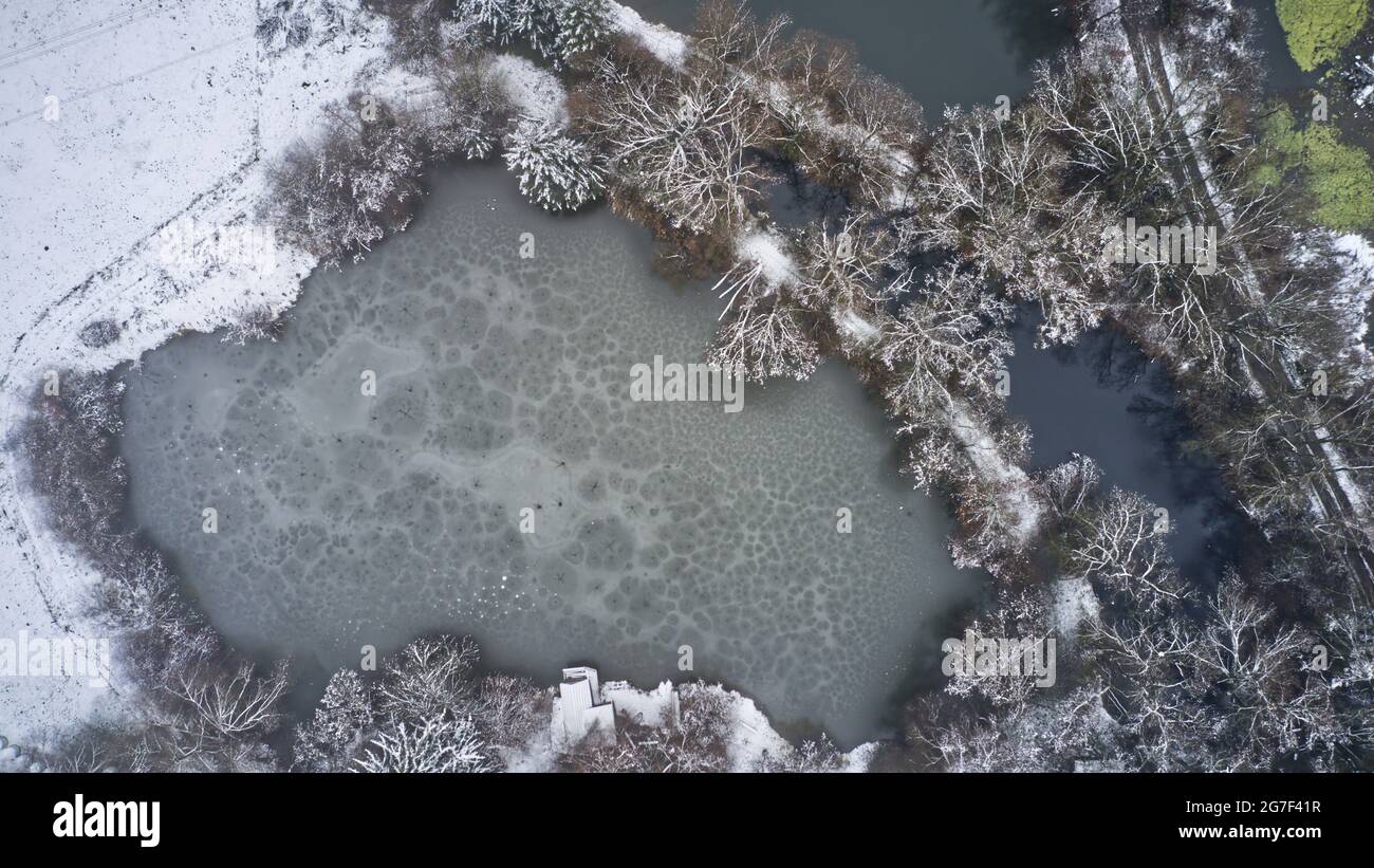 Bird's eye view of a frozen pond in the woods Stock Photo - Alamy