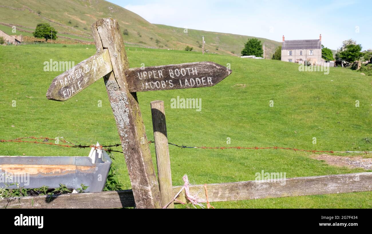 A wooden sign post showing walkers the route up Jacobs Ladder towards ...