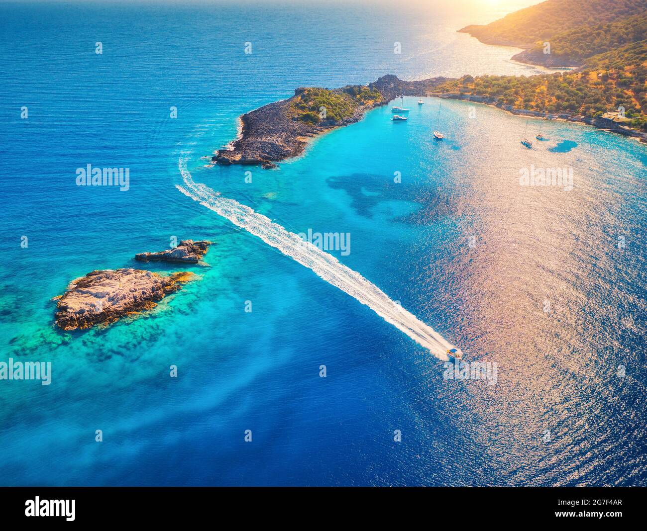 Aerial view of beautiful speed boat on the sea at sunset Stock Photo ...