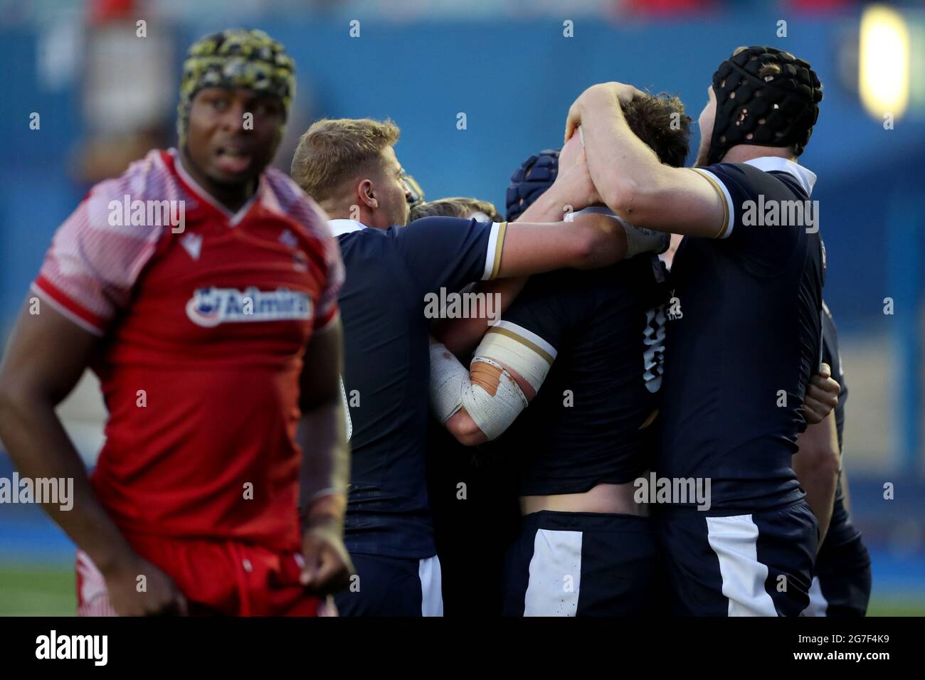 Scotland’s Ben Muncaster celebrates with his team mates after scoring a ...
