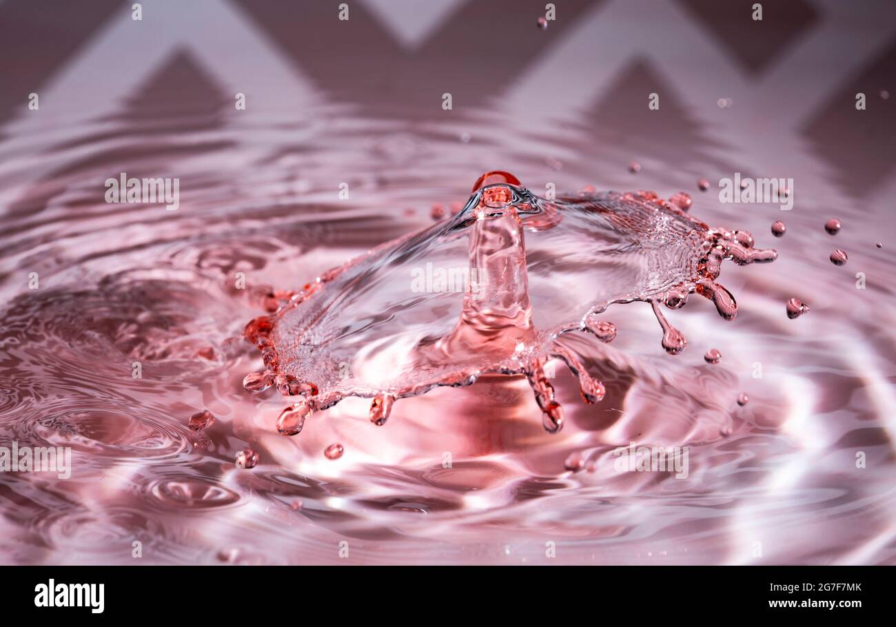 Colour splash of a water drop collision showing up an inverted cone ...