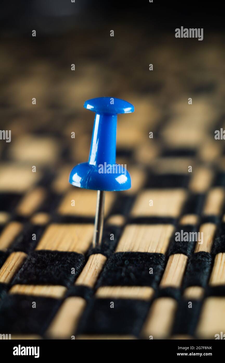 Selective focus of a push pin fixed in a surface Stock Photo - Alamy