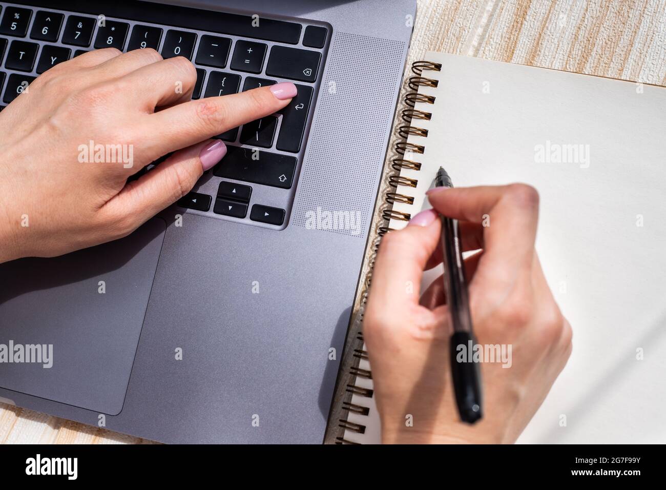 Hands Pressing Computer Keyboard Keys While Writing With Pencil In ...