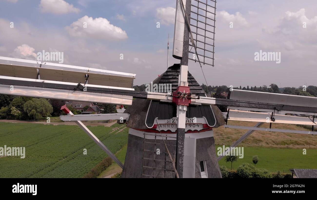 Aerial of iconic mill construction in countryside in The Netherlands ...