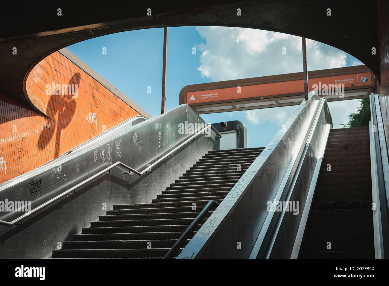 Low angle shot of underground concrete stairs and escalator Stock Photo ...