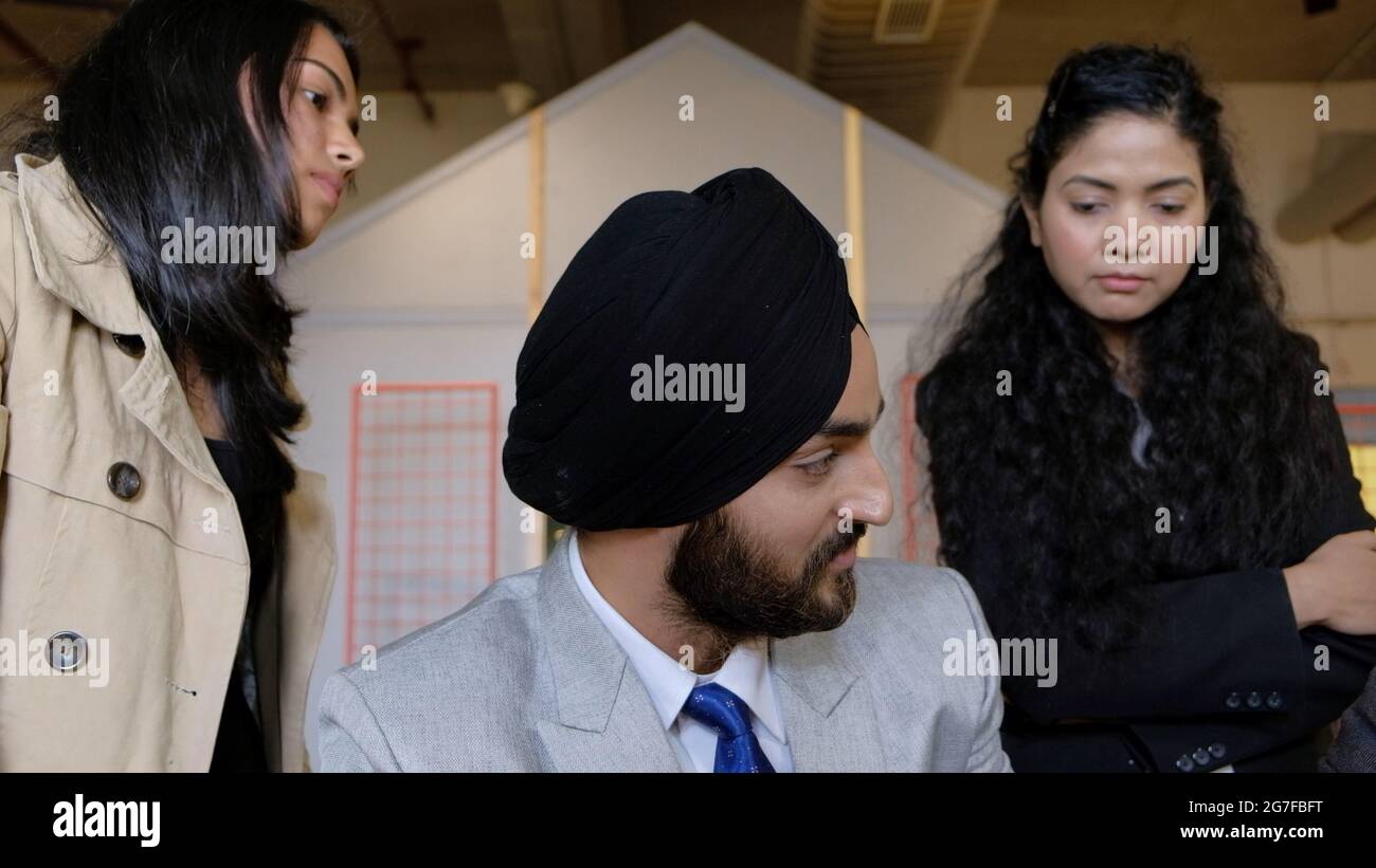 South Asian women and a man in black turban from India Stock Photo - Alamy