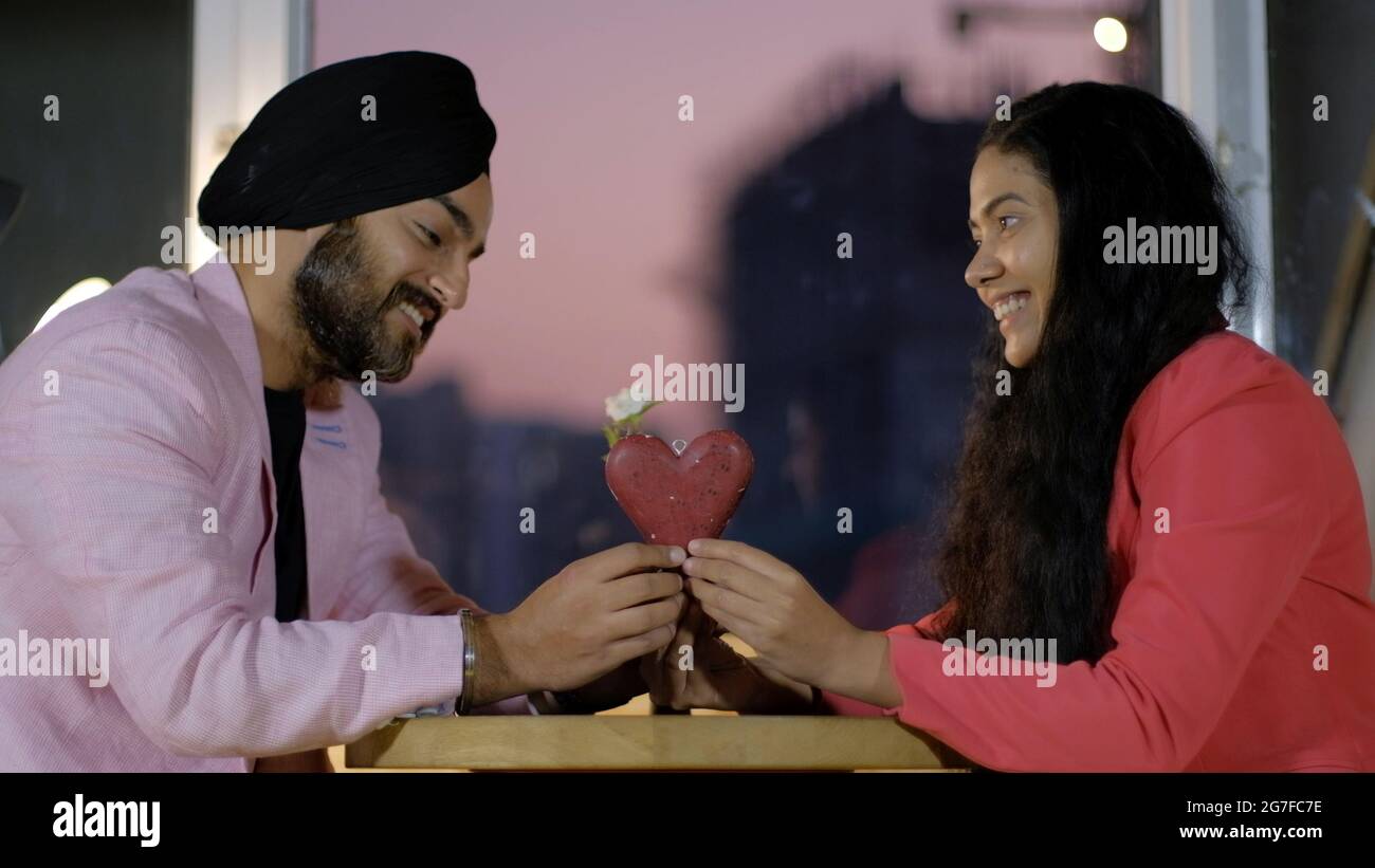Beautiful Indian couple celebrating Valentine in a restaurant Stock ...