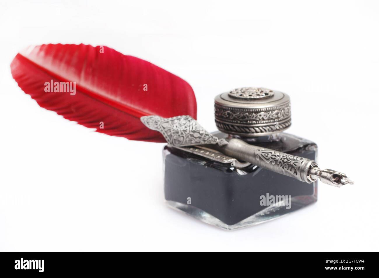Old vintage red fountain pen with inkwell on white background Stock ...