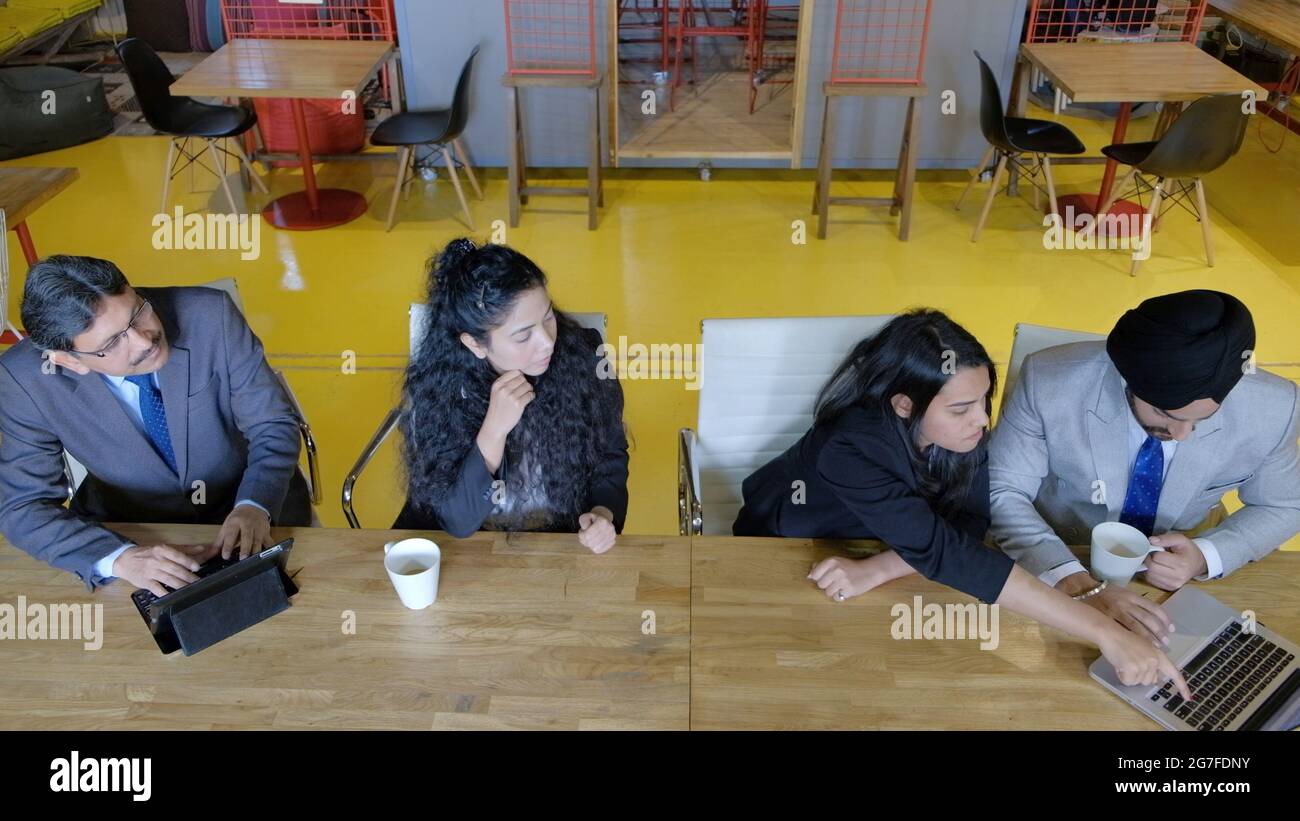 South Asian partners from India having a discussion Stock Photo - Alamy