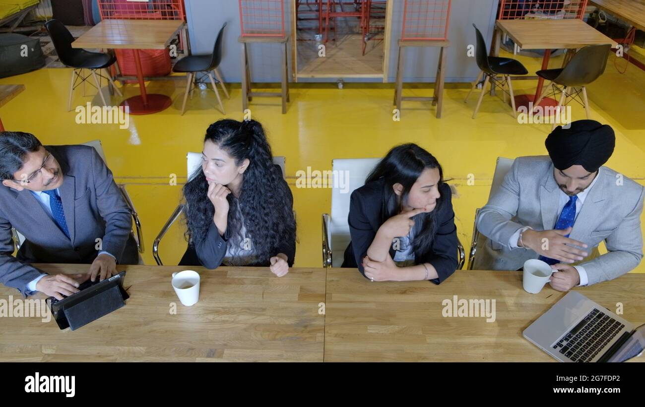 Group of Indian workers during a business meeting in office Stock Photo ...