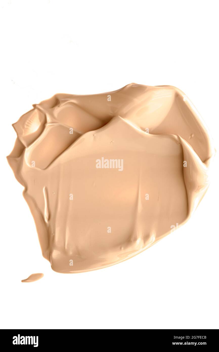 Beige beauty cosmetic texture isolated on white background, smudged ...