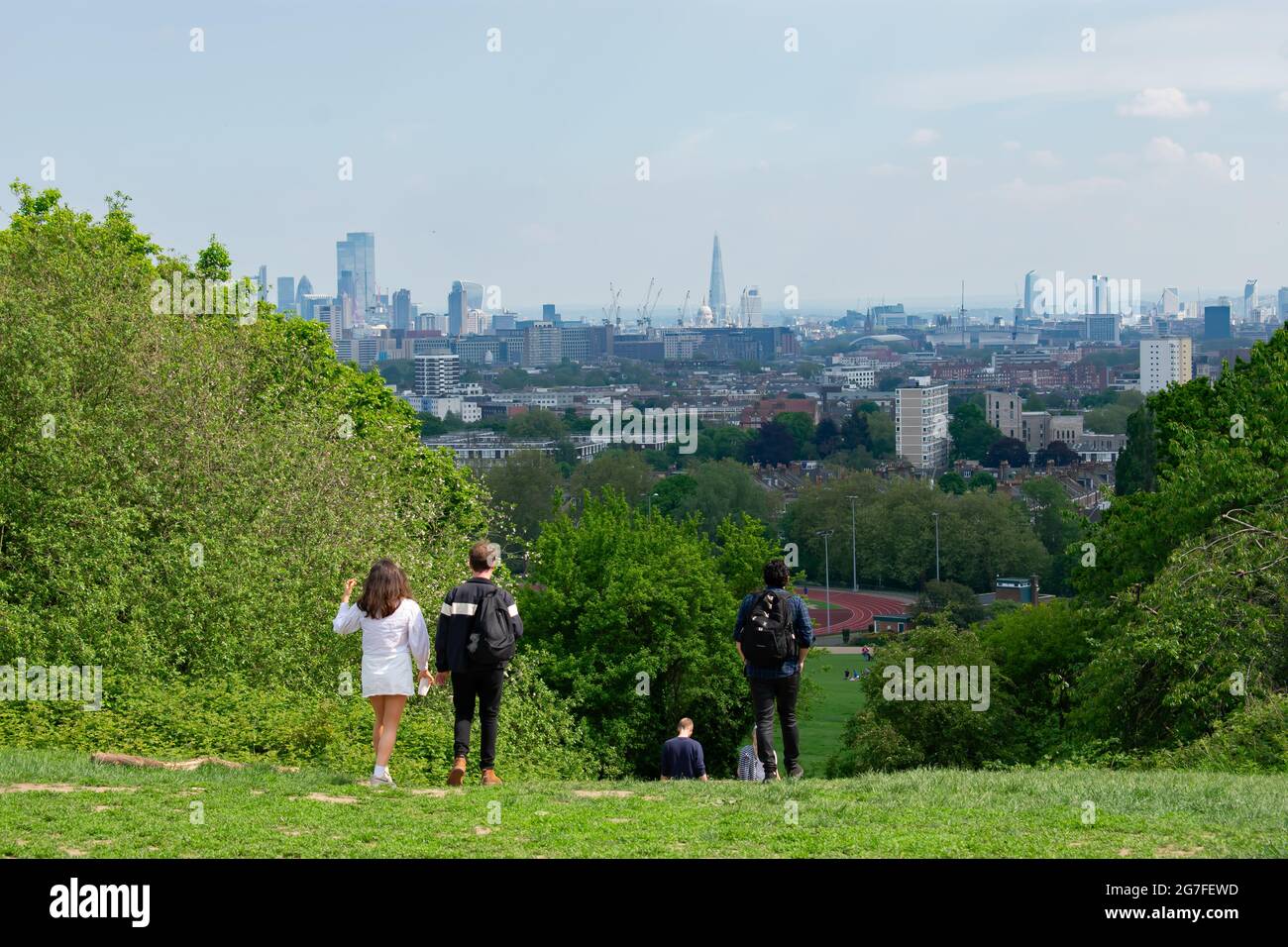 Visitors walk downhill towards the Parliament Hill athletics track from ...