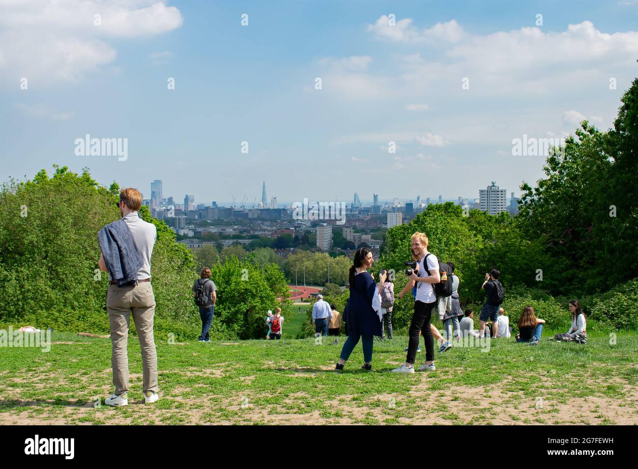 Visitors stand and take in the view form Parliament Hill Viewpoint in ...