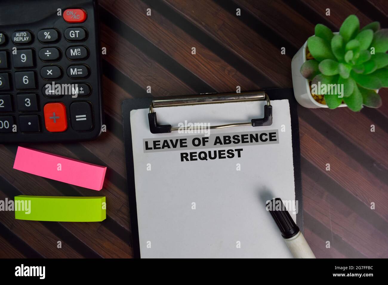 Leave of Absence Request write on a paperwork isolated on Wooden Table ...