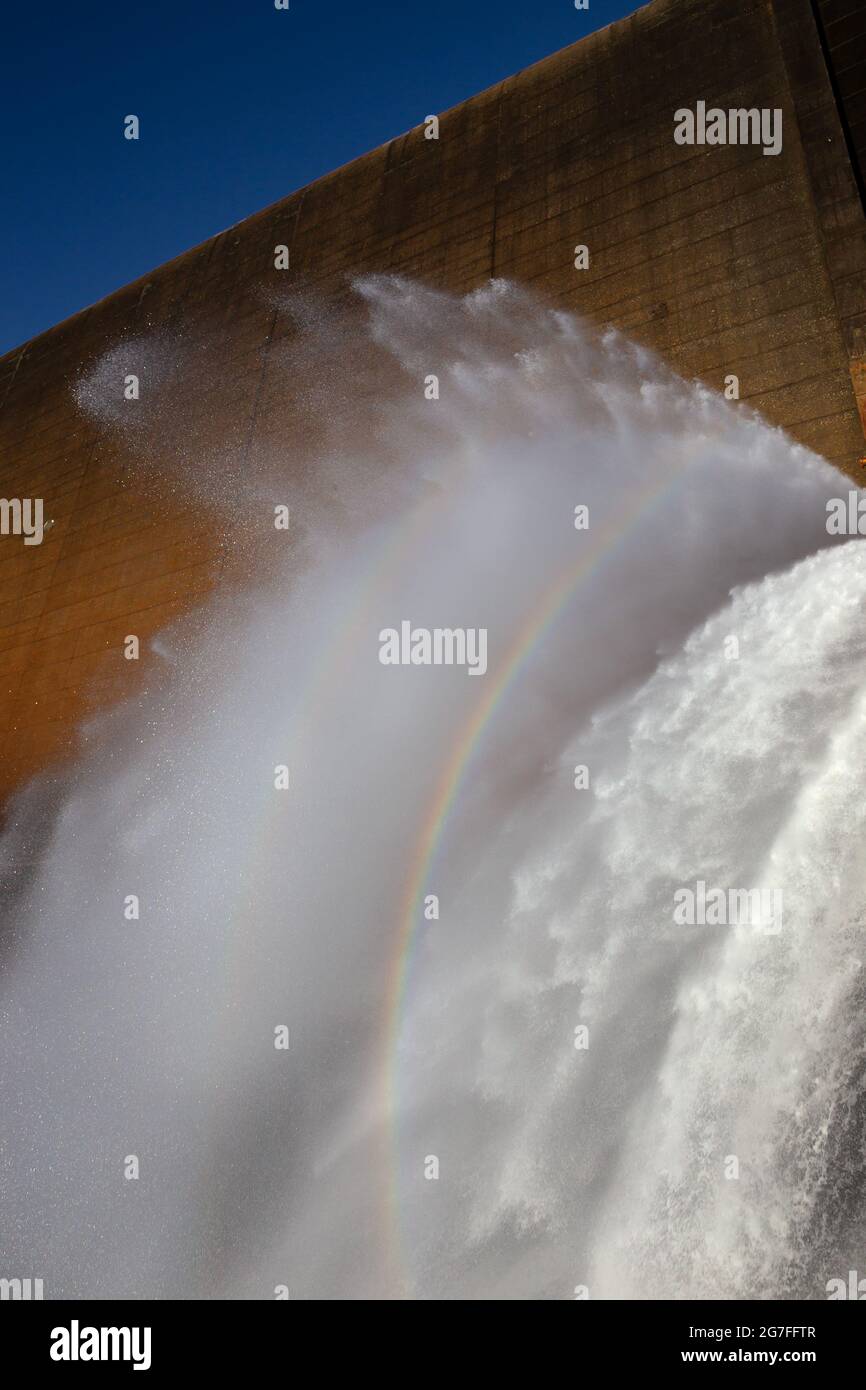 Rainbow in rushing water at Tinaroo Falls Dam Stock Photo - Alamy