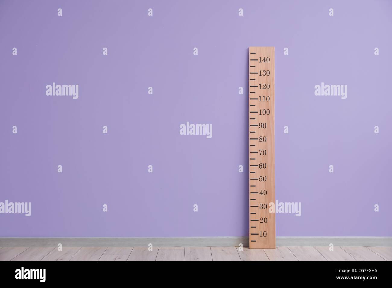 Big ruler for height measuring near color wall Stock Photo - Alamy