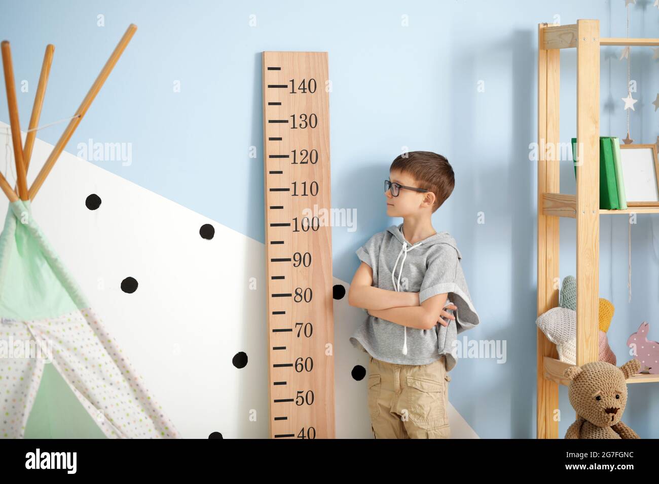 Little boy measuring height at home Stock Photo - Alamy