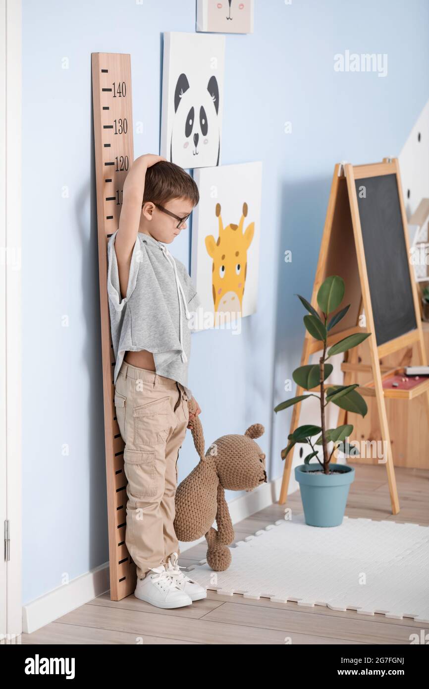 Little boy measuring height at home Stock Photo - Alamy