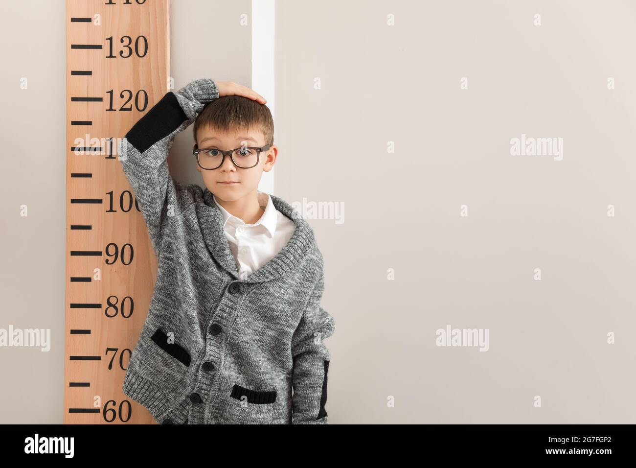 Little boy measuring height at home Stock Photo - Alamy