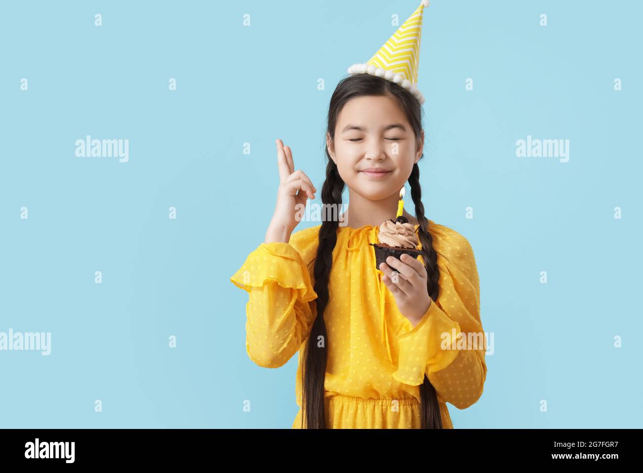 Cute little girl celebrating Birthday on color background Stock Photo ...