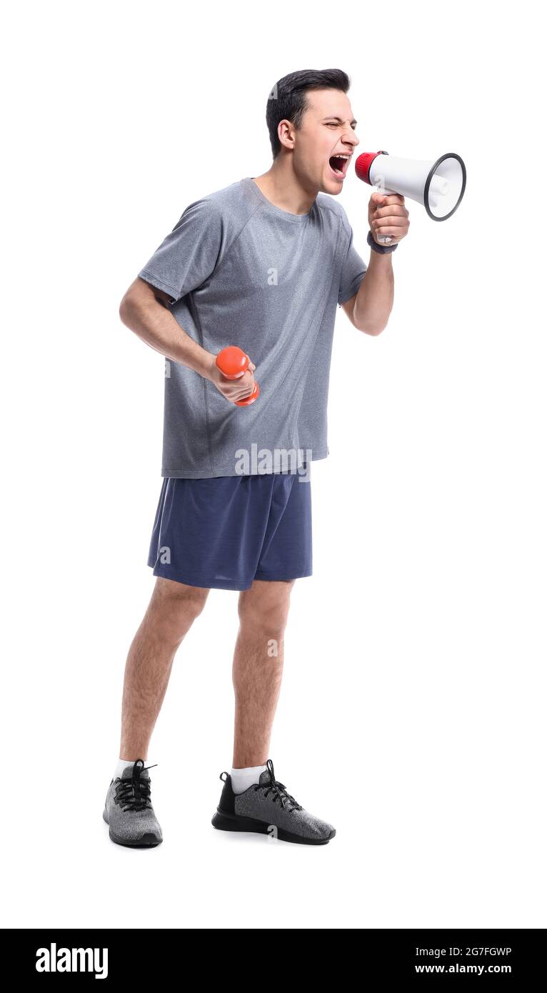 Sporty male coach with megaphone on white background Stock Photo - Alamy