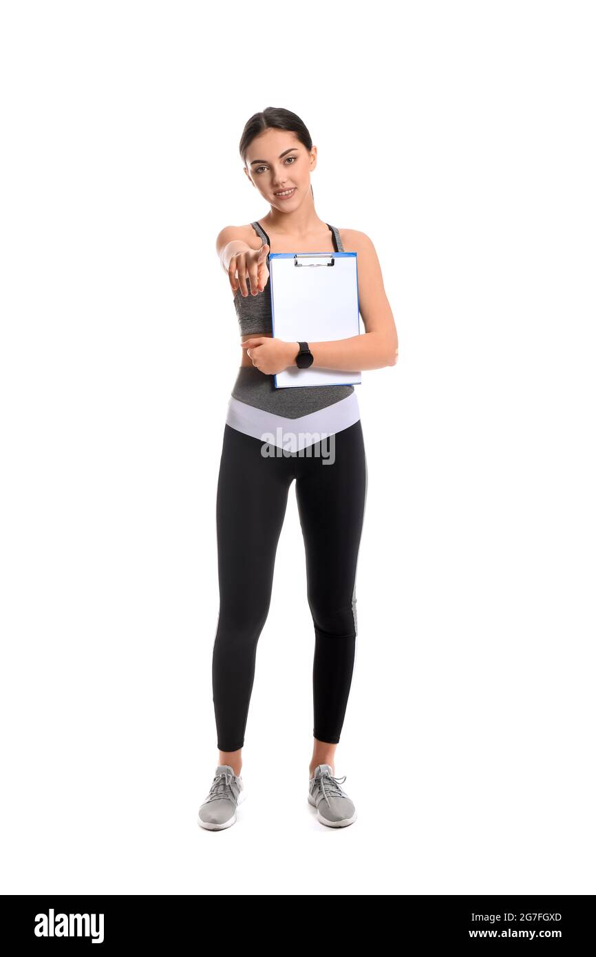 Sporty female coach on white background Stock Photo - Alamy