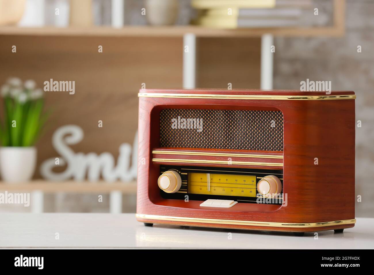 Retro radio receiver on table in room Stock Photo - Alamy
