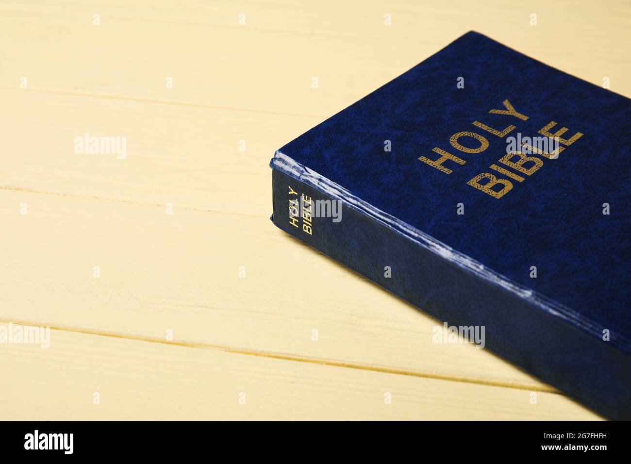 Holy Bible on color wooden background Stock Photo - Alamy
