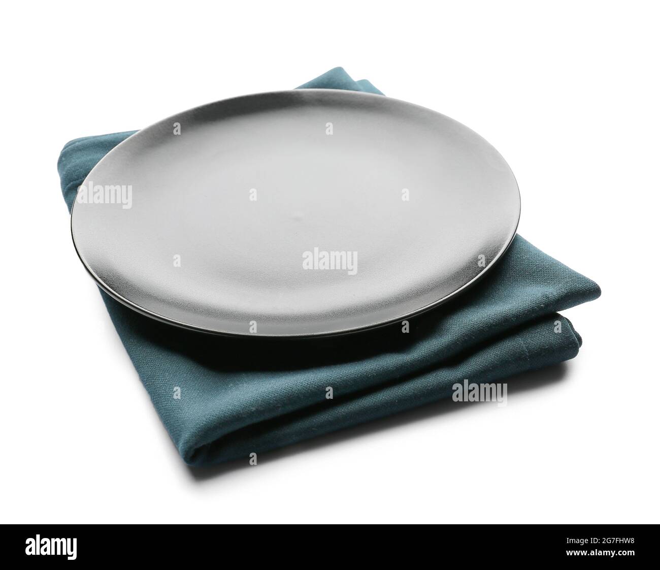 Fabric napkin and plate on white background Stock Photo - Alamy