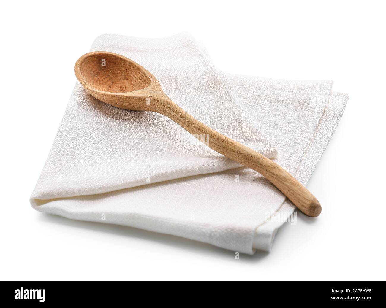 Fabric napkin and wooden spoon on white background Stock Photo - Alamy