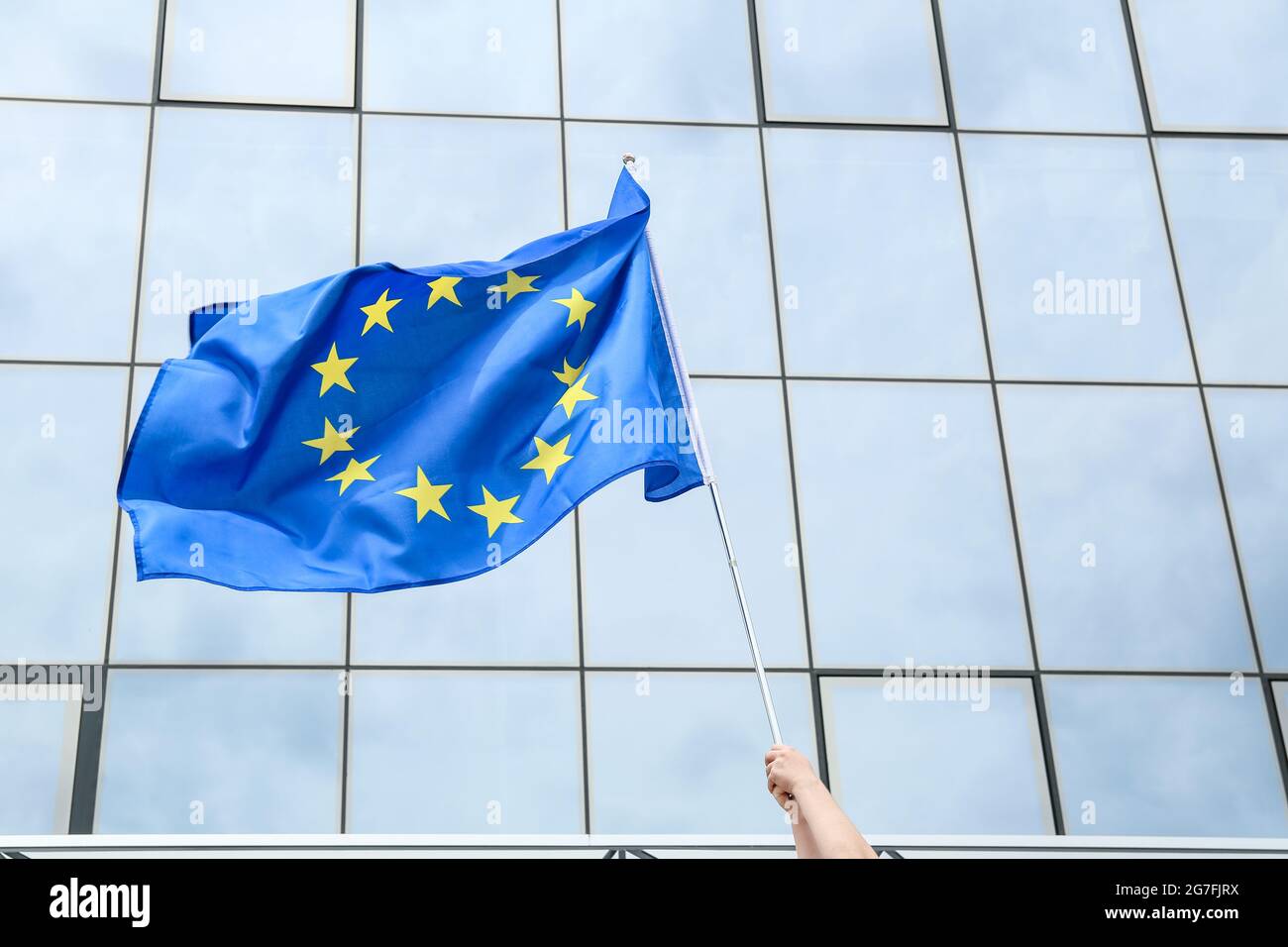 Eu flag waving person hi-res stock photography and images - Alamy