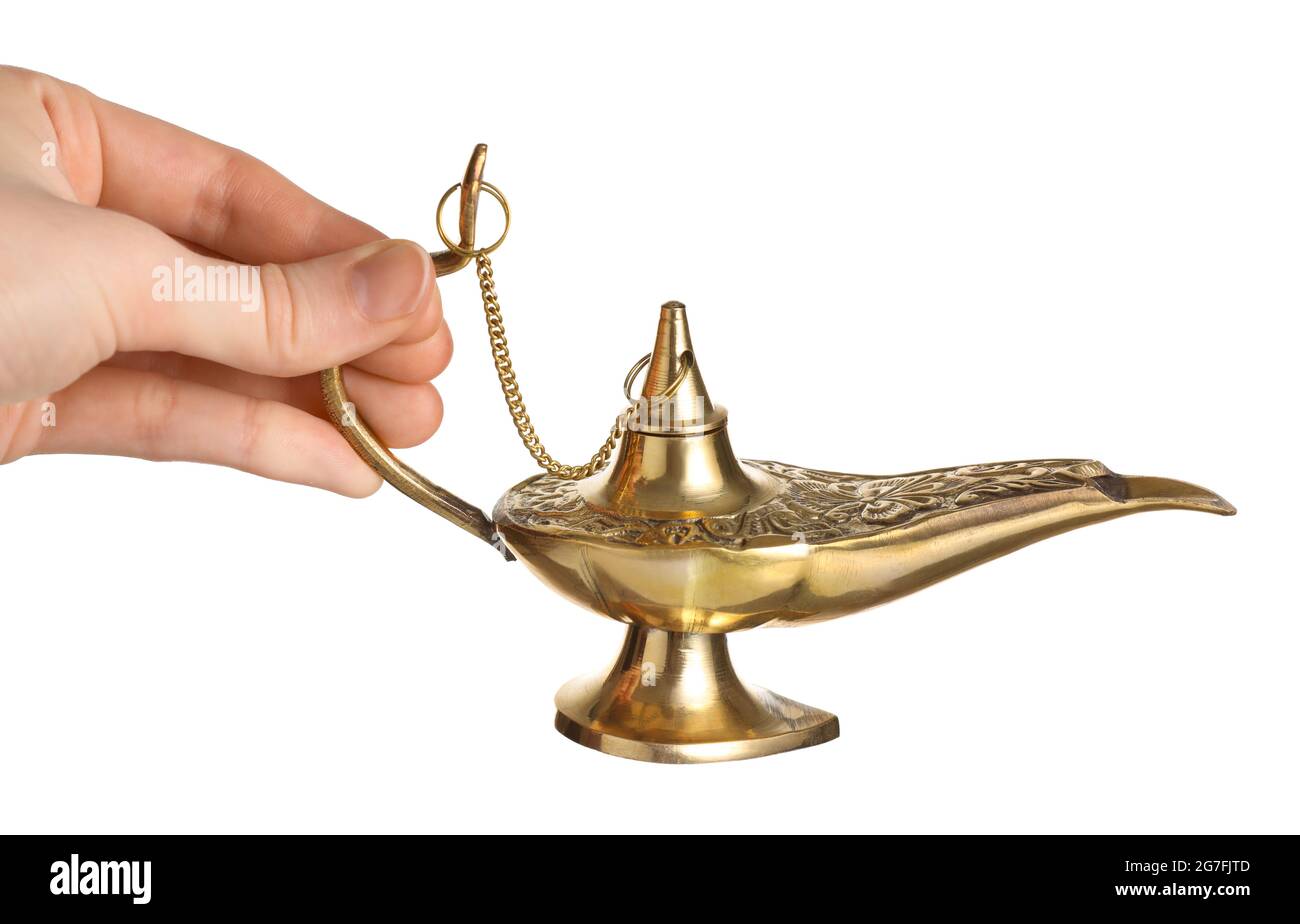 Hand with Aladdin lamp of wishes on white background Stock Photo - Alamy