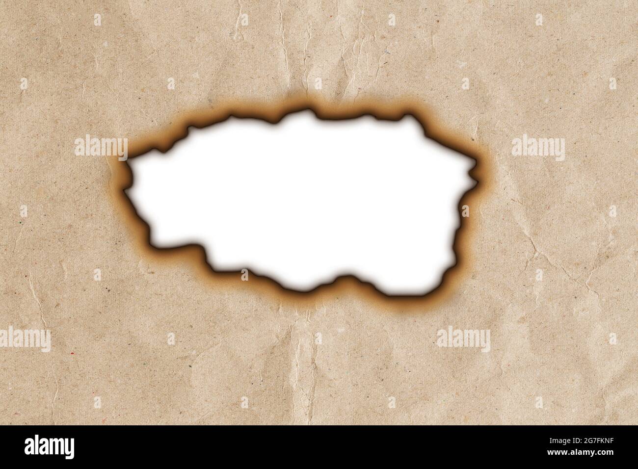 burned hole on piece of brown paper texture. Empty white Burning Hole ...