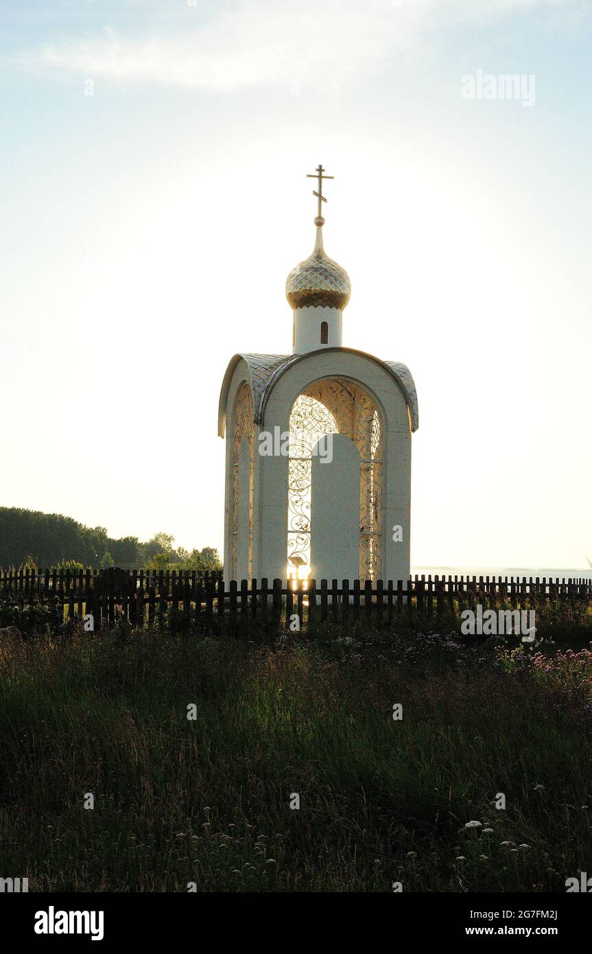 An Orthodox chapel on top of a hill, with a dome covering the setting ...