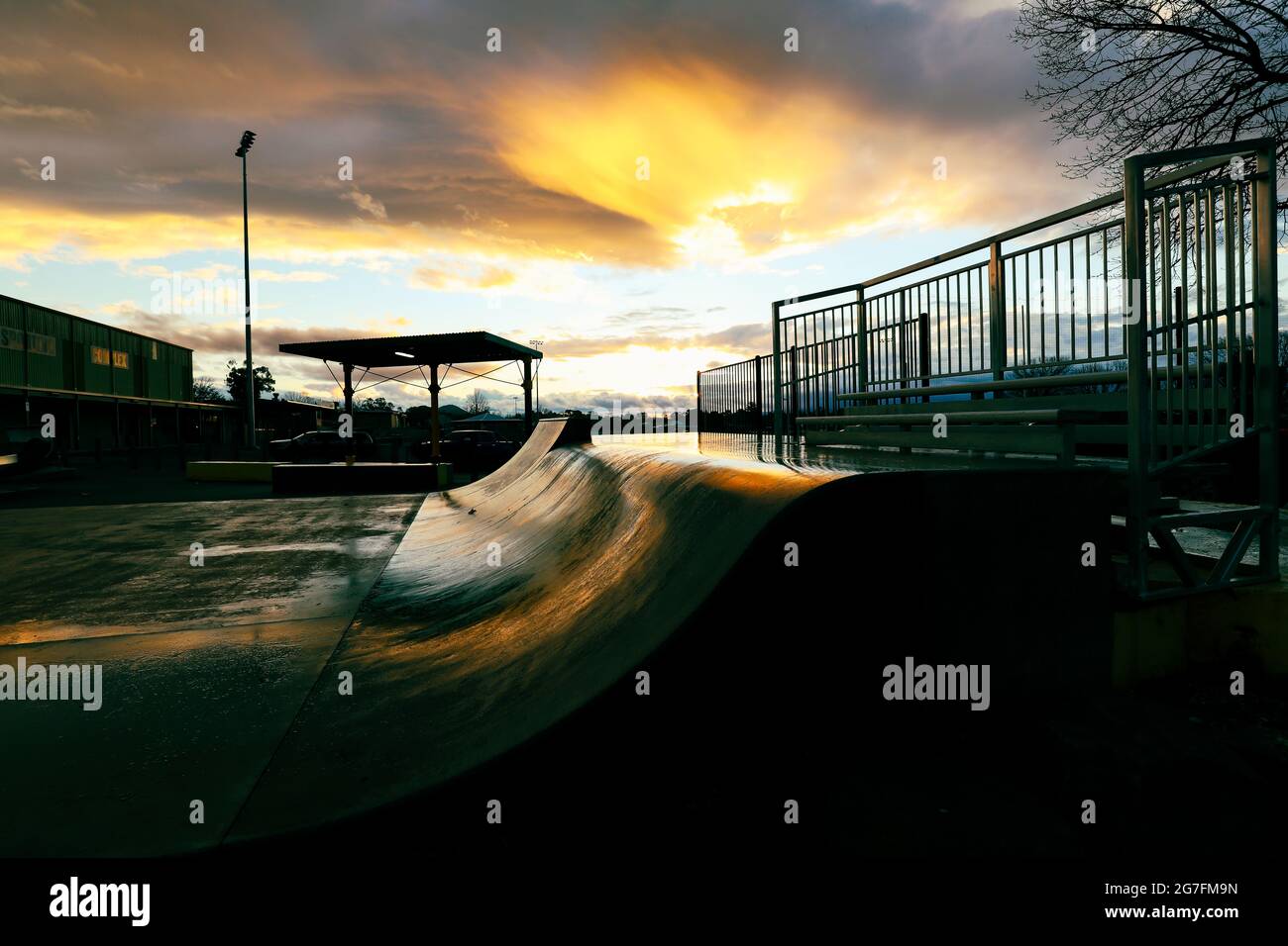 Skate park ramp at twilight with last golden sunlight reflected Stock ...