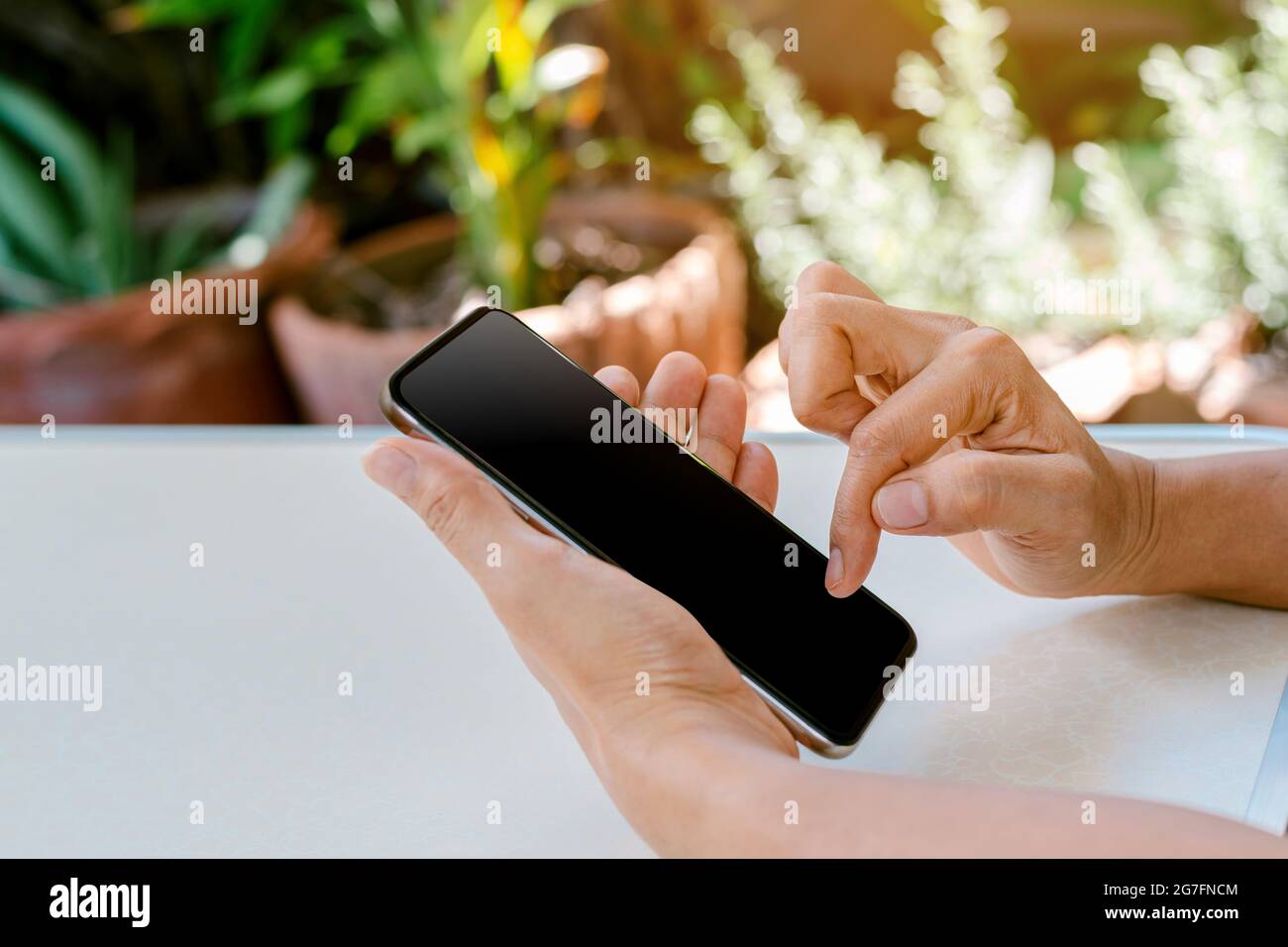 Hand of human touching on black screen of smart phone, use for using ...