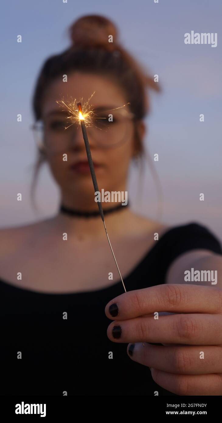 Hand holding firework stick hi-res stock photography and images - Alamy