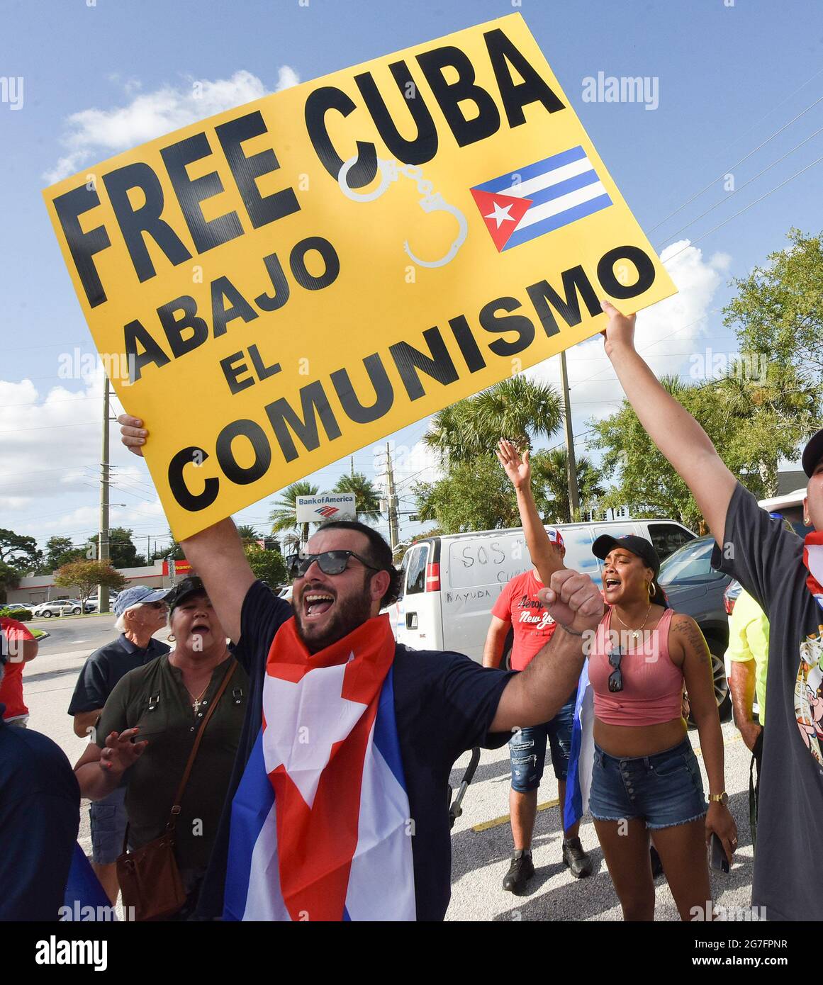 Protesters hold a placards as they demonstrate in Orlando in support of ...