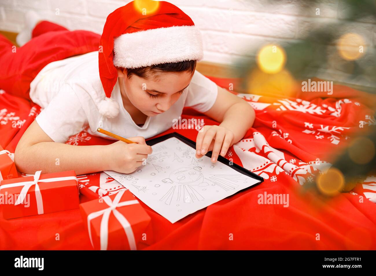 Happy children writing letter Santa home near Christmas tree Stock ...