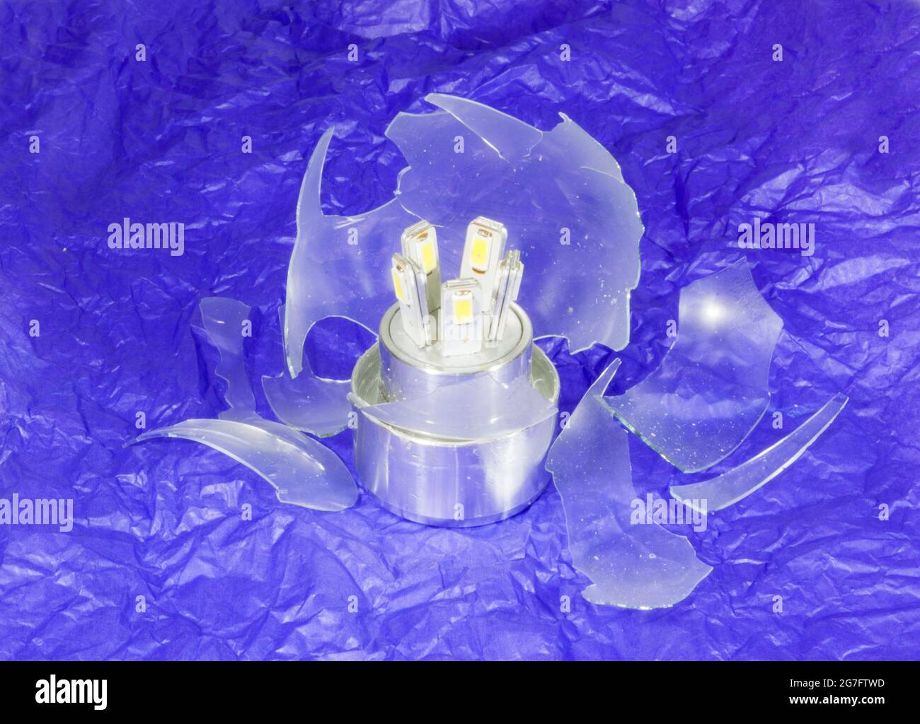 Broken led bulb broken glass, interior, elements Stock Photo - Alamy