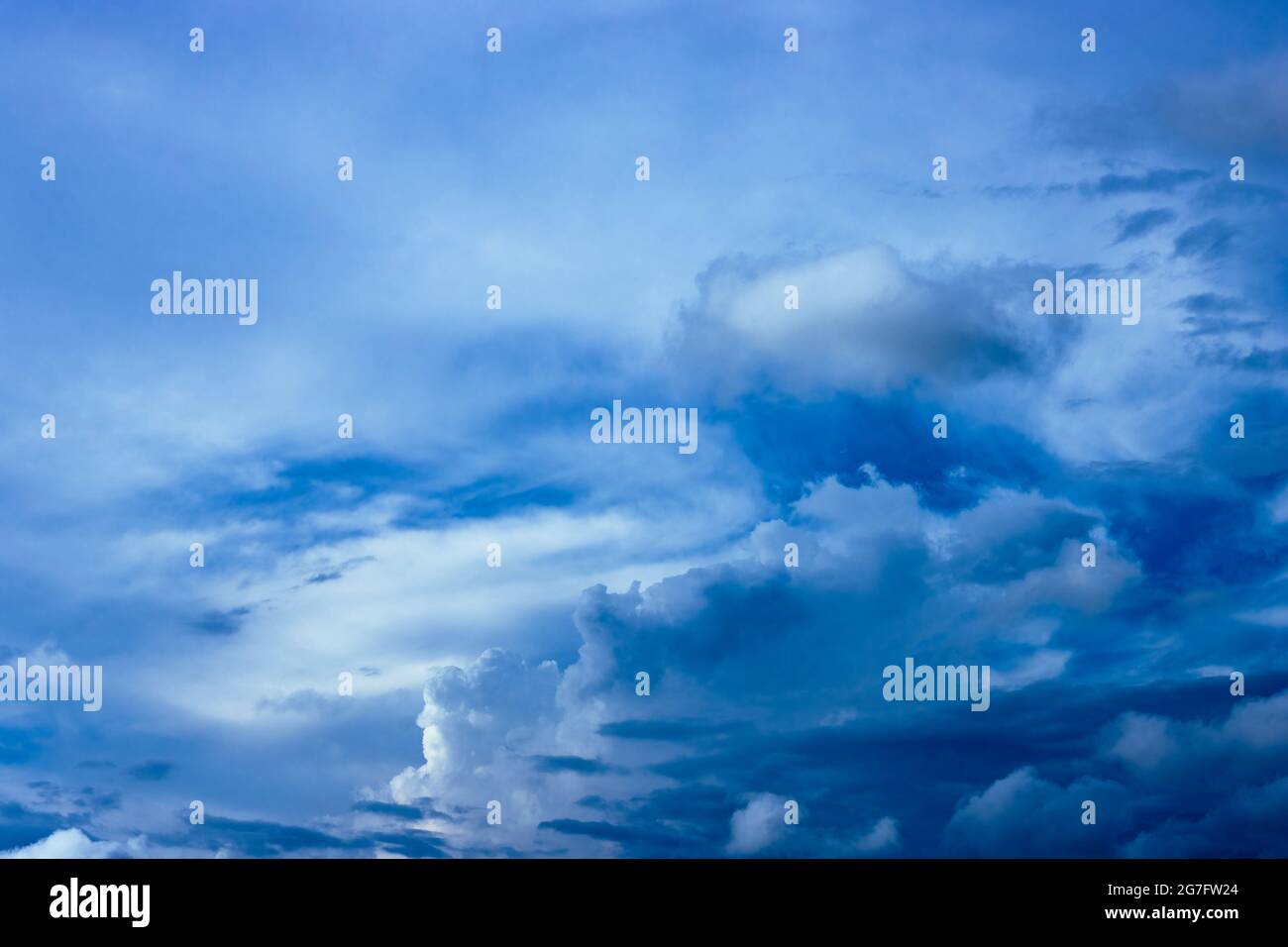 Saturated blue sky with heavy clouds Stock Photo - Alamy