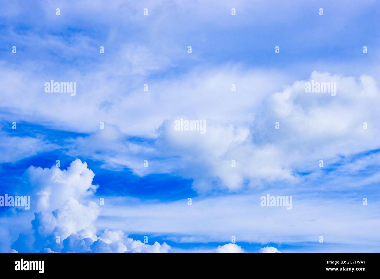 Bright sunny sky with moving clouds Stock Photo - Alamy